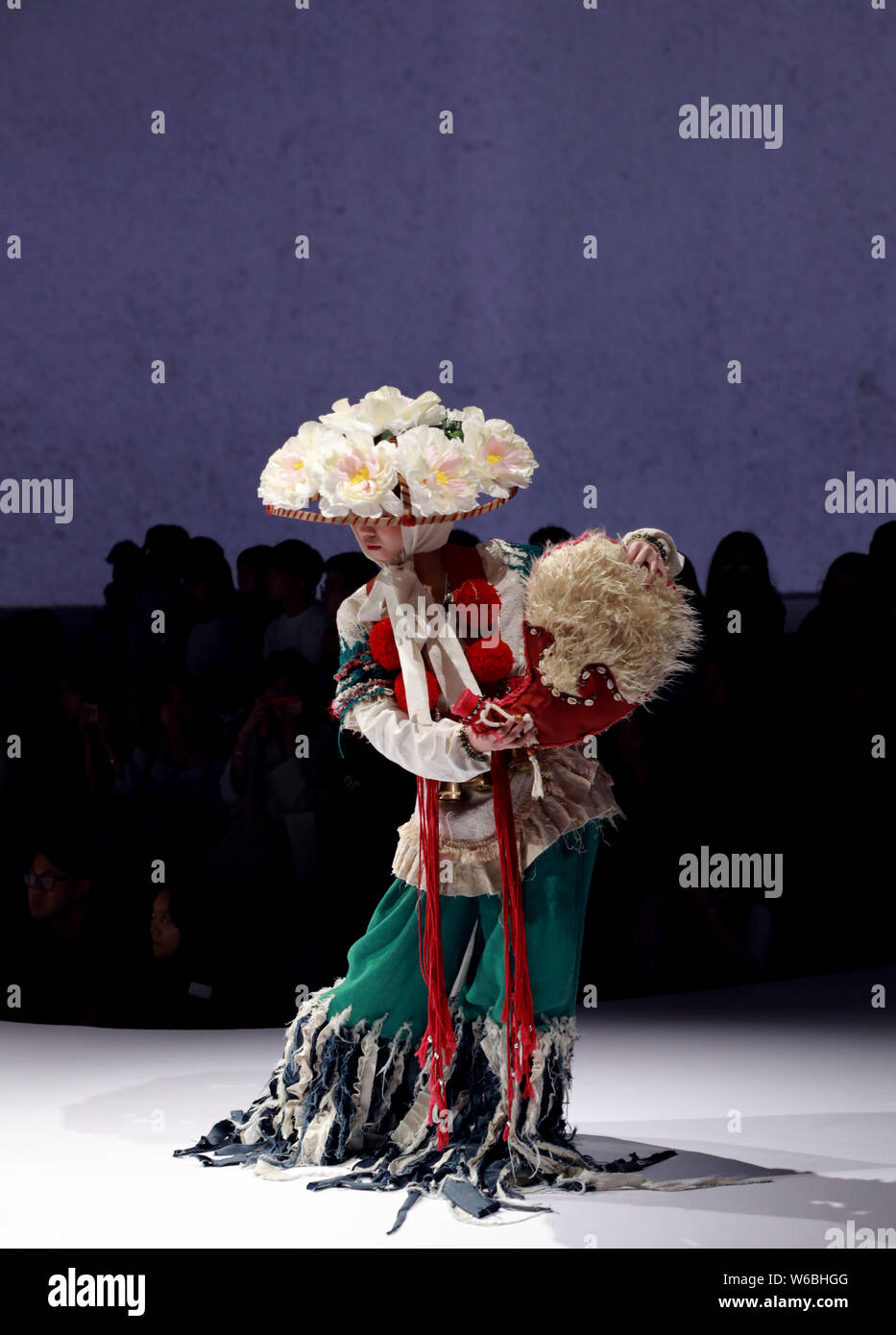 A model displays a creation by a graduate during a fashion show for ...