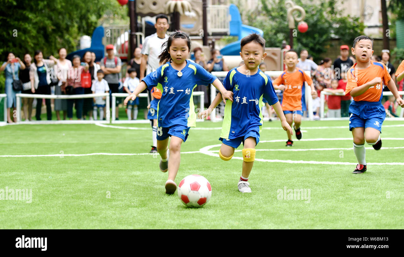 Chinese children take part in a football contest at a kindergarten in ...
