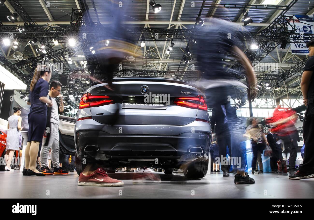 --FILE--People visit the stand of BMW during a preview of the 15th ...