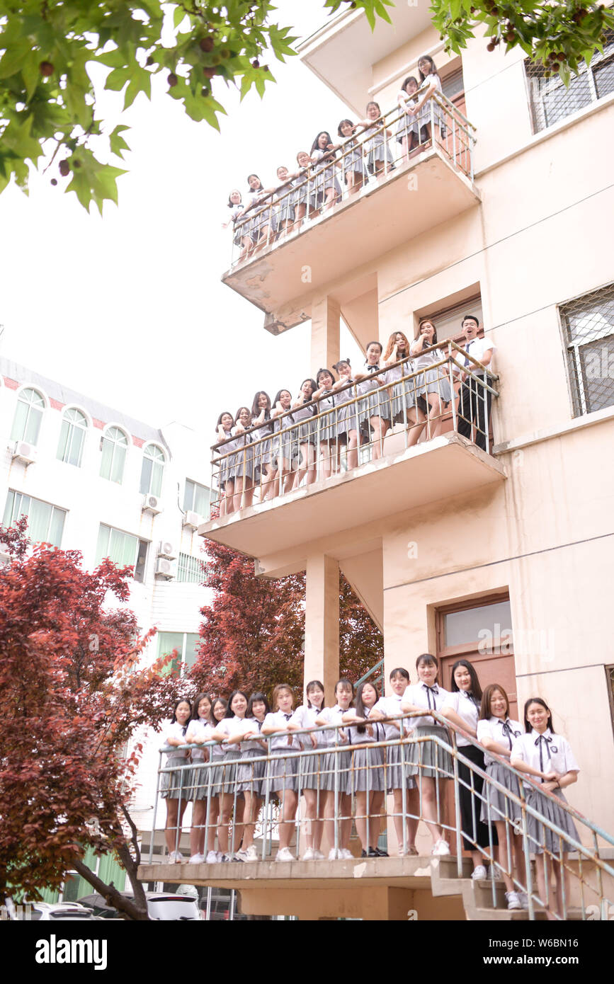 36 female students pose for creative graduation photos with their only ...