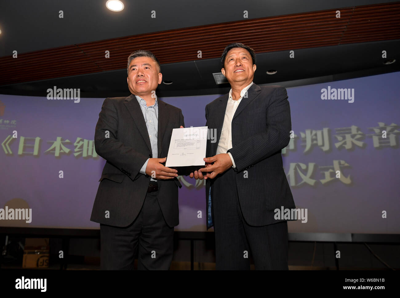 Wang Zhiqiang, left, curator of at the Museum of the Imperial Palace of ...