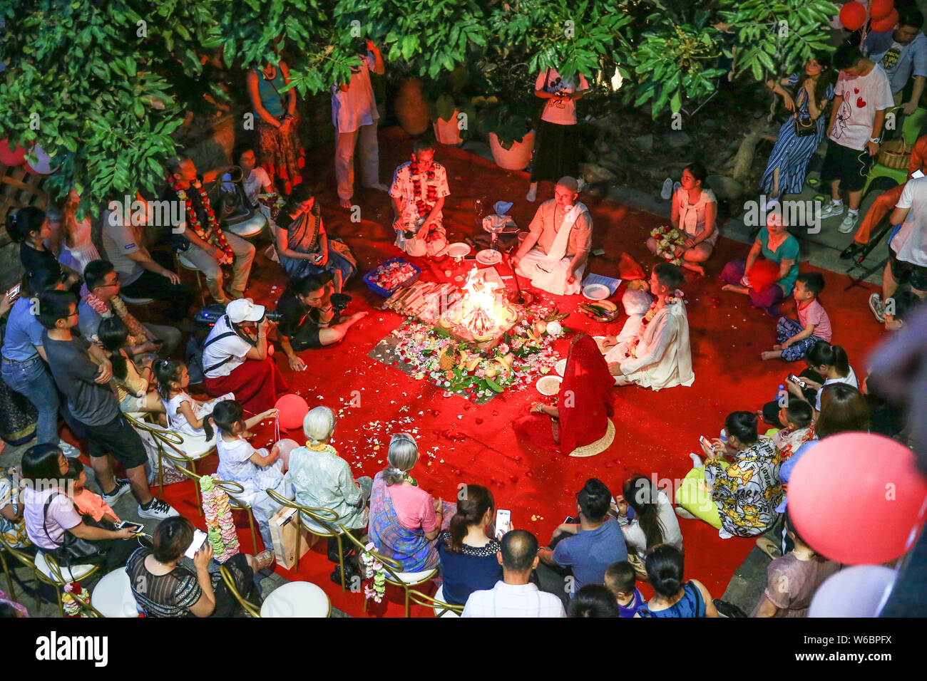 American man Pabuk and his Chinese wife Li Fei, both of whom dressed in ...