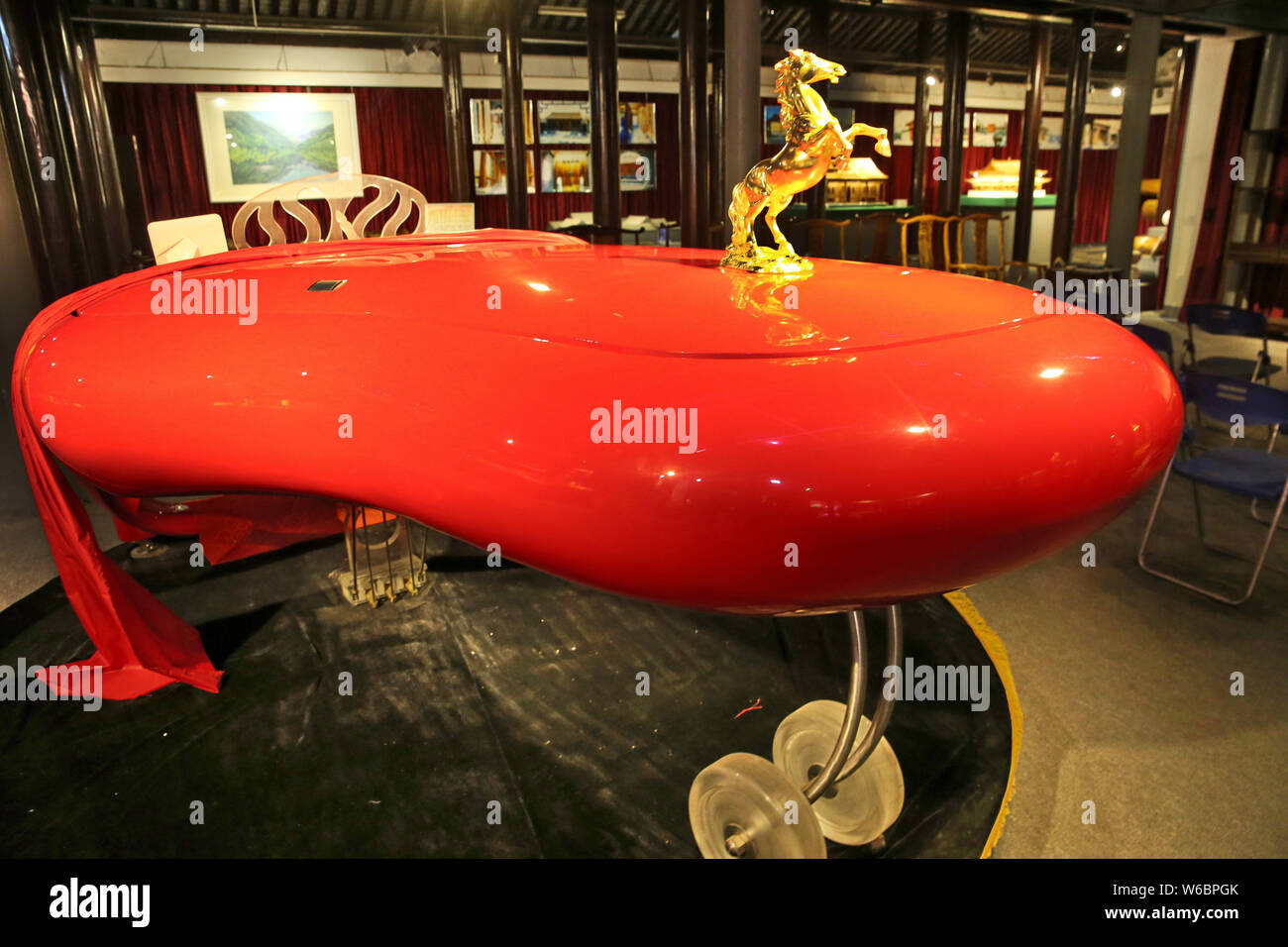 A limited edition of Ferrari sports car-inspired pianos, dubbed as ...