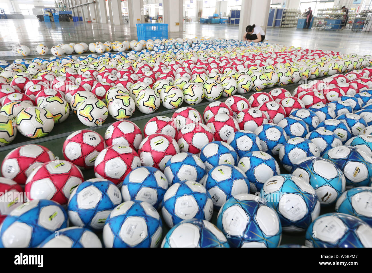 A Chinese worker manufactures footballs for the 2018 FIFA World Cup at ...