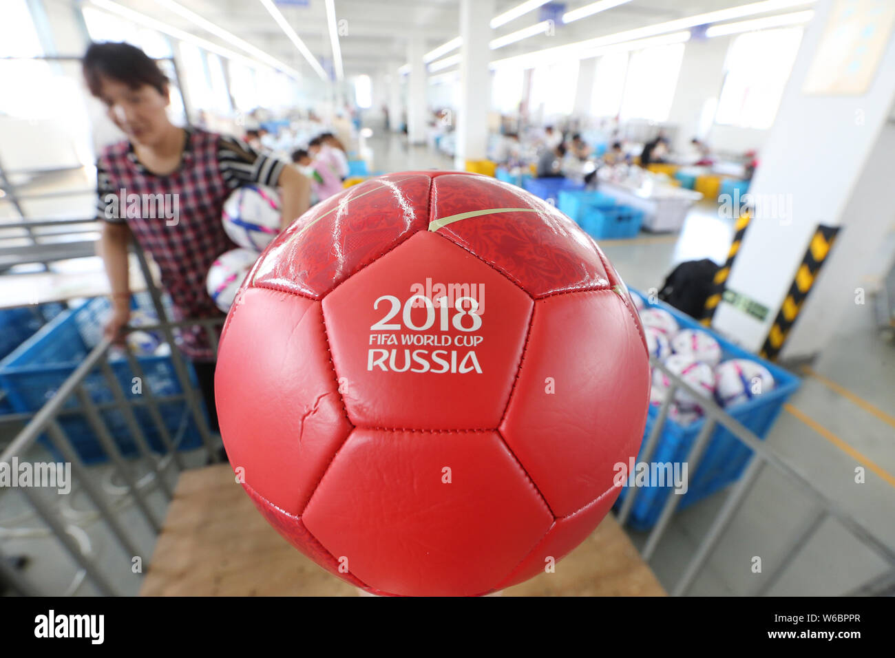 A Chinese worker manufactures footballs for the 2018 FIFA World Cup at ...