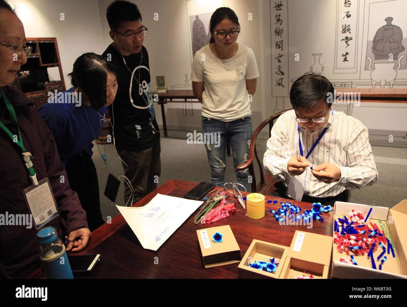 64-year-old Chinese craftsman Zhao Shuxian makes velvet flowers at his ...