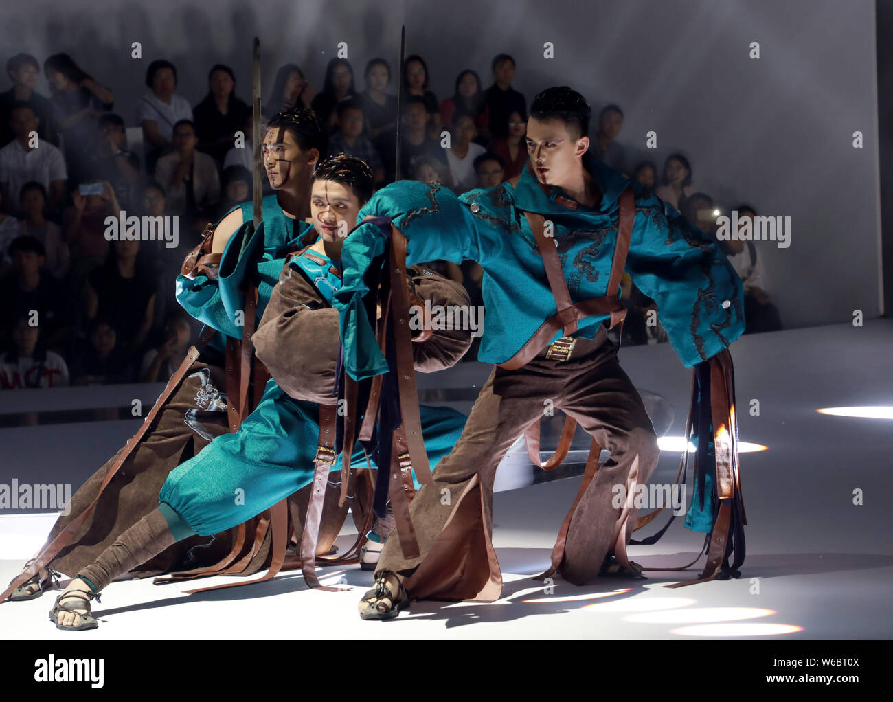 Models display creations by a graduate during a fashion show for ...