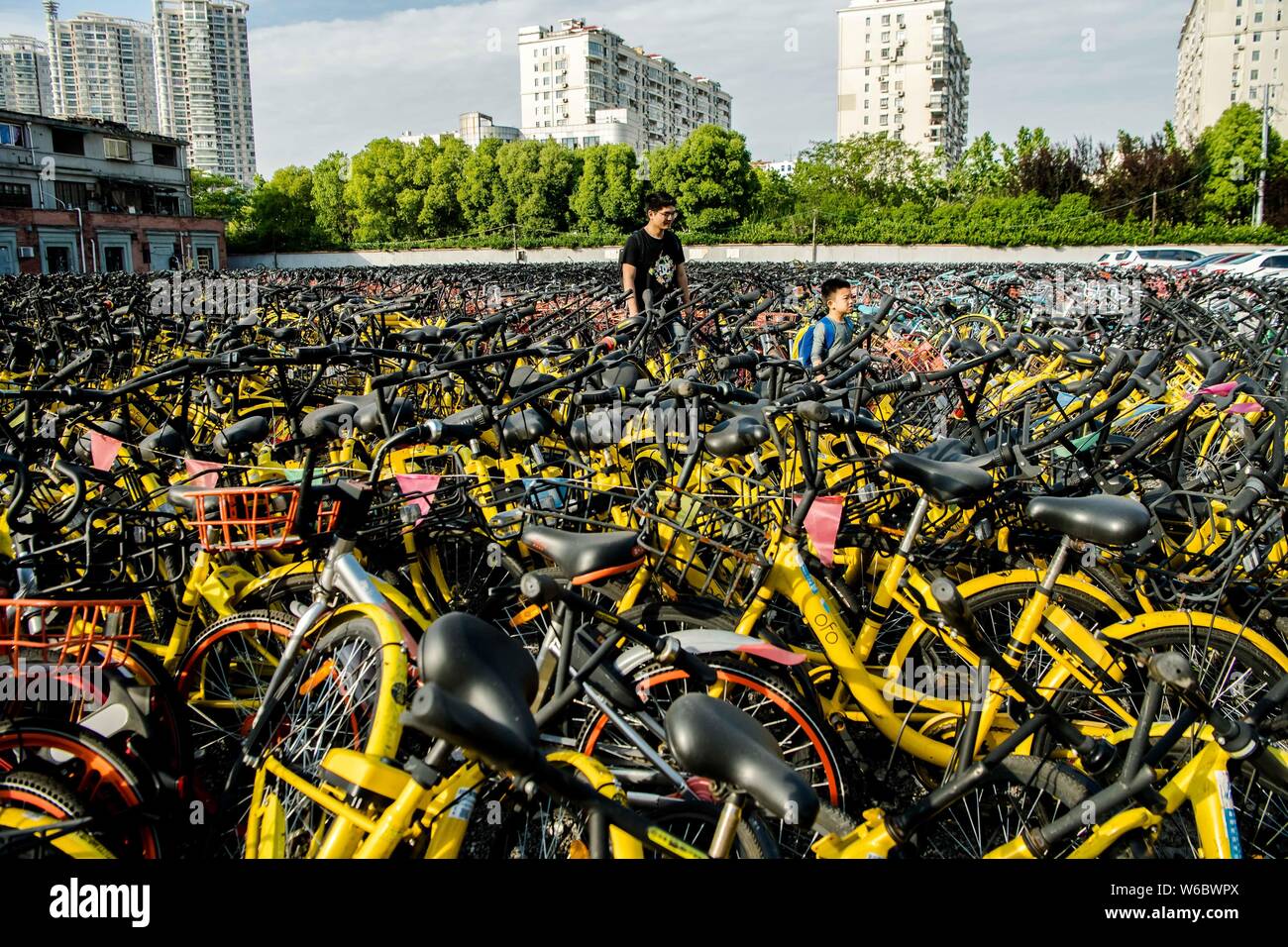 Abandoned bicycles of Chinese bike-sharing services are piled up at a ...