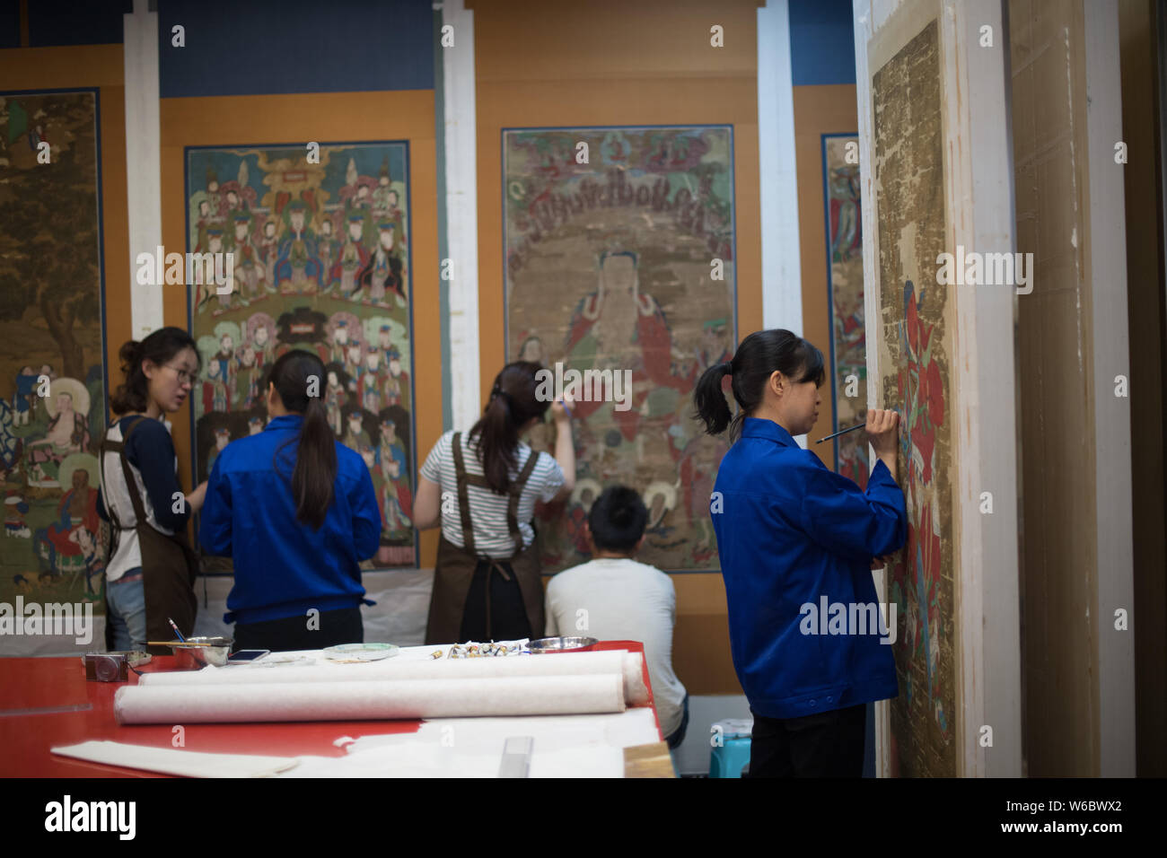 Chinese workers restore cultural relics at the Culture Relics ...