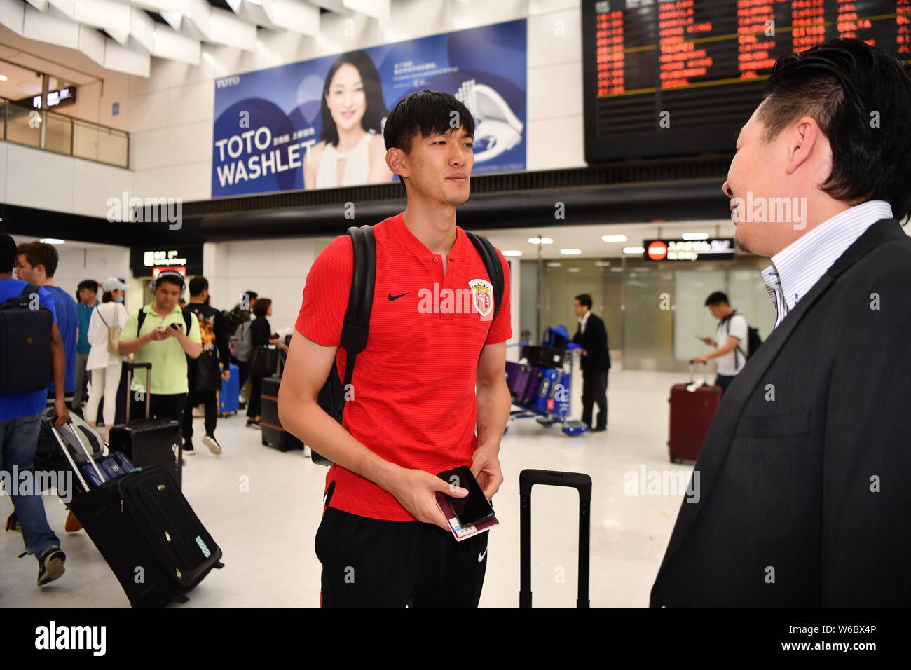 Yan Junling of China's Shanghai SIPG F.C. is pictured after arriving at ...