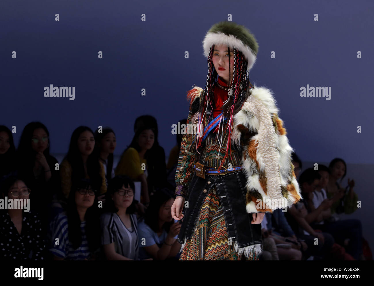 A model displays a creation by a graduate during a fashion show for ...