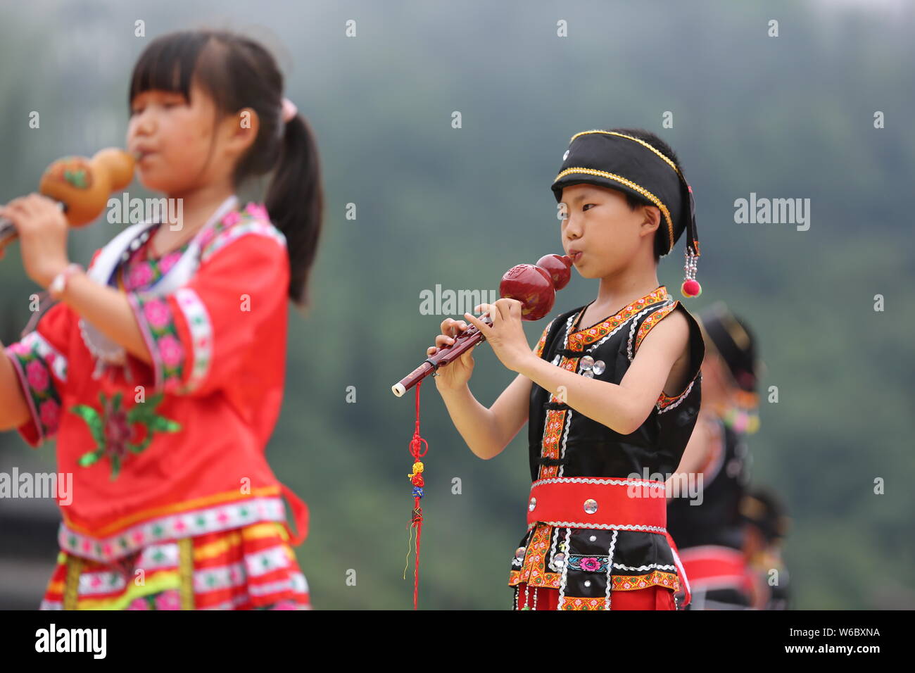 Chinese people of Miao ethnic group dressed in traditional costumes ...