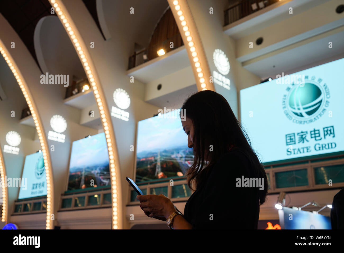 --FILE--A visitor is seen at the stand of State Grid Corporation of ...