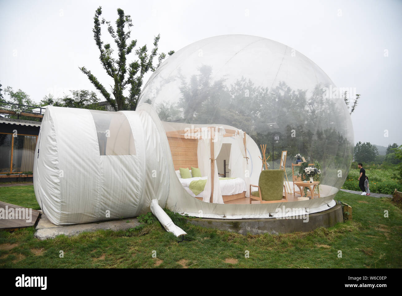One of the 12 see-through inflatable bubble rooms is set up at a bubble ...