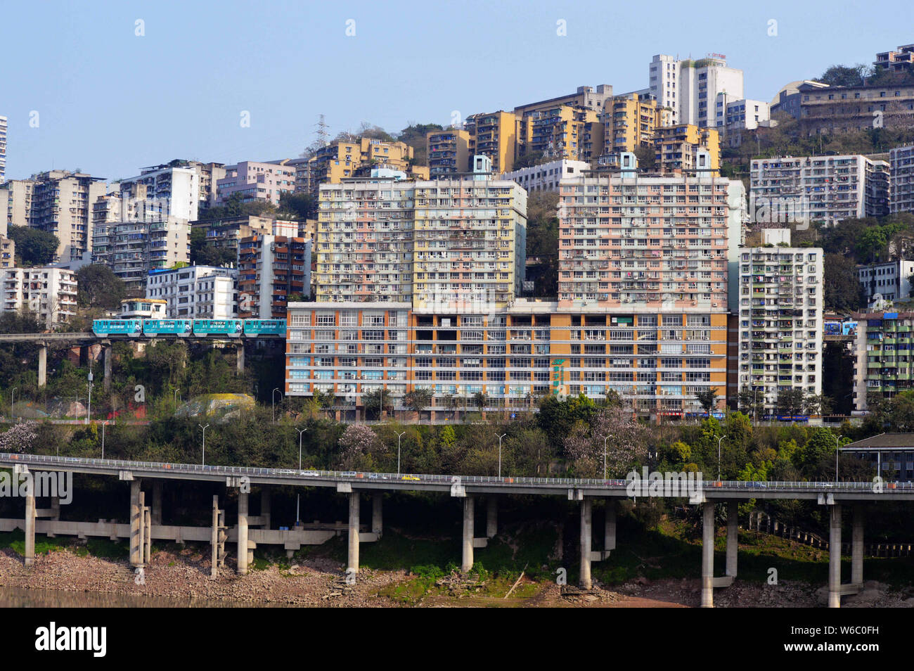 The No.2 light-rail train drives through a building in Liziba Station ...