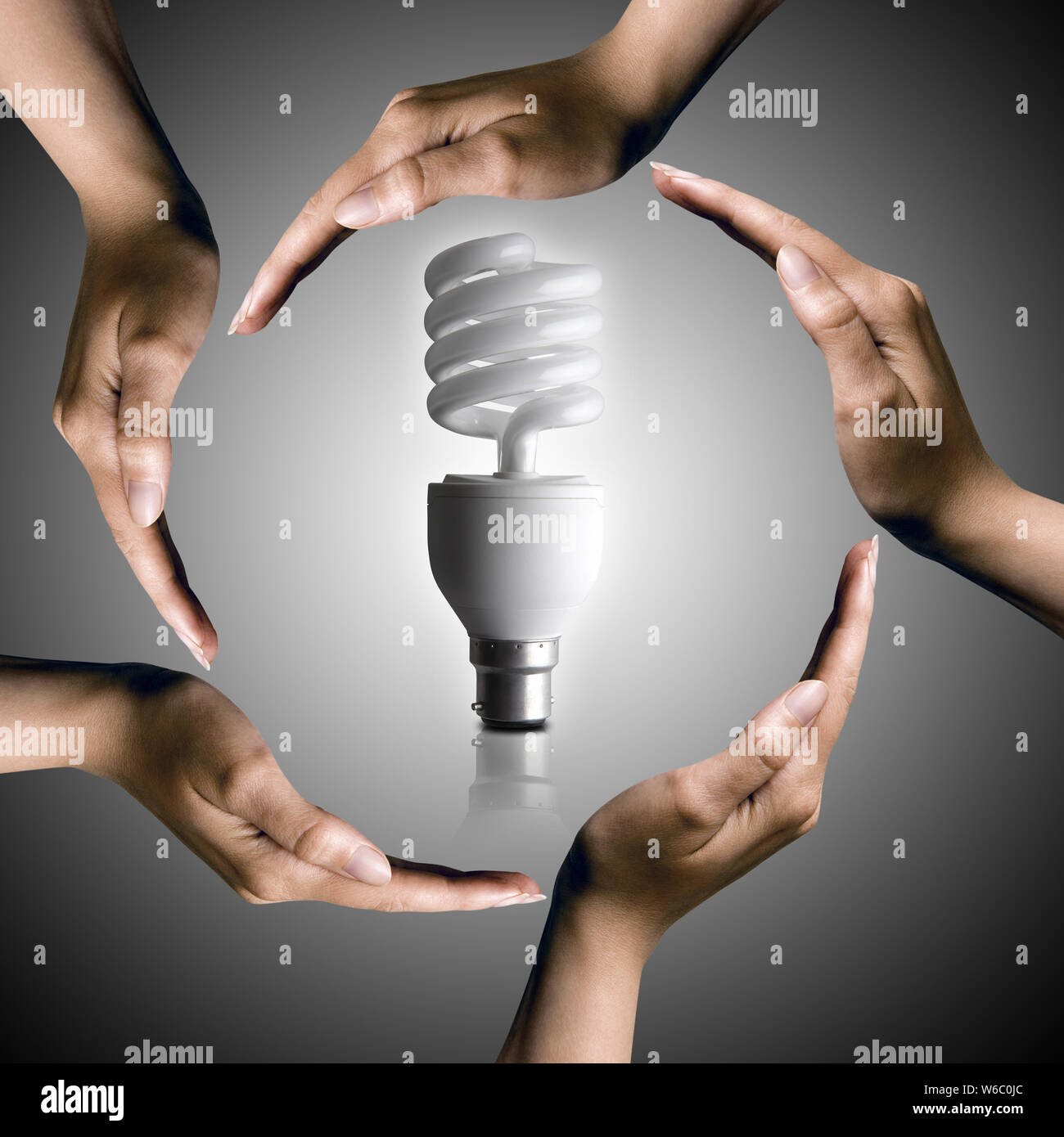 People hands representing save energy Stock Photo - Alamy