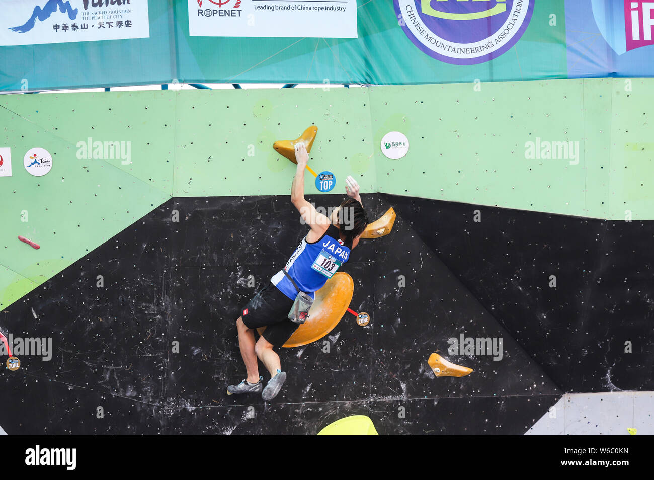 Yoshiyuki Ogata of Japan competes in the men bouldering qualification ...