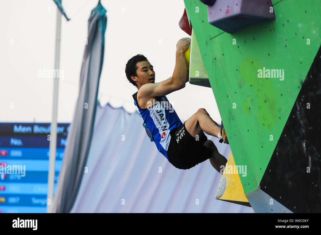 Keiichiro Korenaga of Japan competes in the men bouldering ...