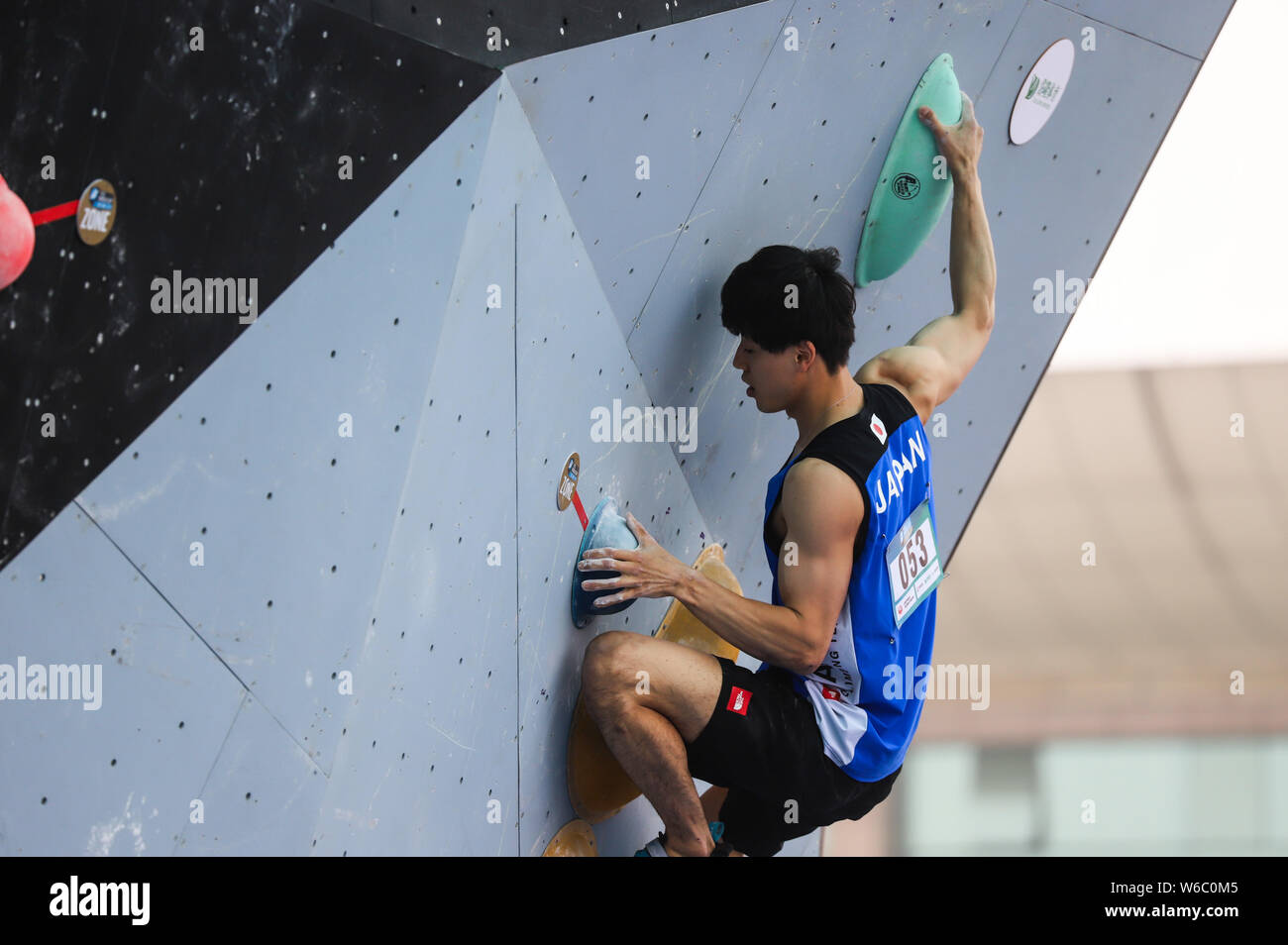 Kokoro Fujii of Japan competes in the men bouldering qualification ...