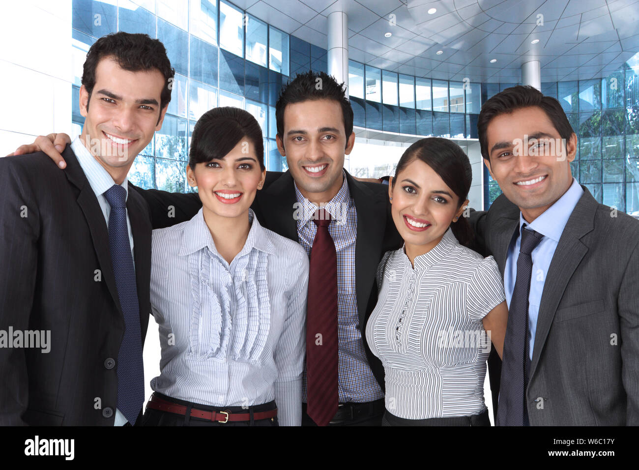 Portrait of business executives smiling Stock Photo - Alamy