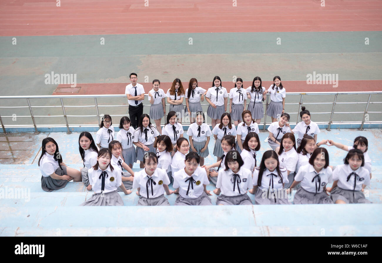 36 female students pose for creative graduation photos with their only ...