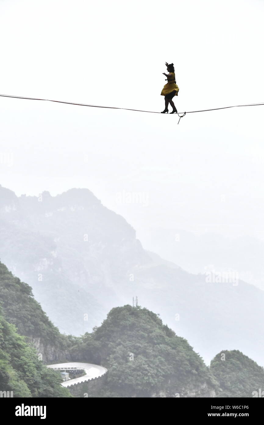 Faith Dickey of the U.S. participates in a slackline contest in high ...
