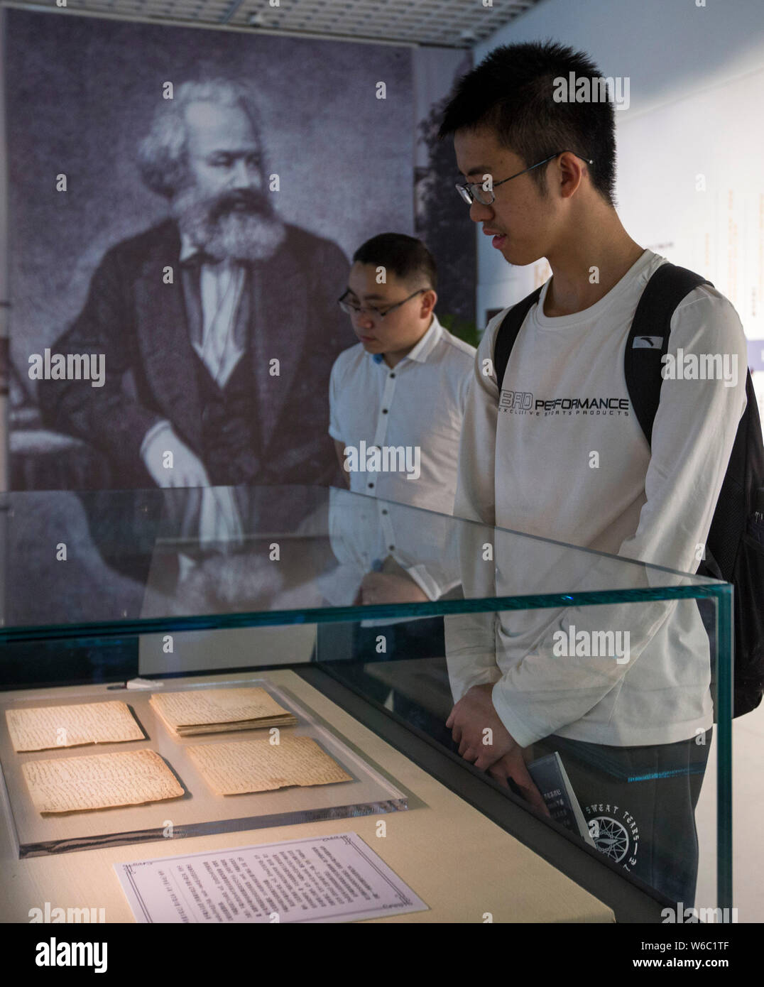 Visitors look at German philosopher Karl Marx's original manuscript ...