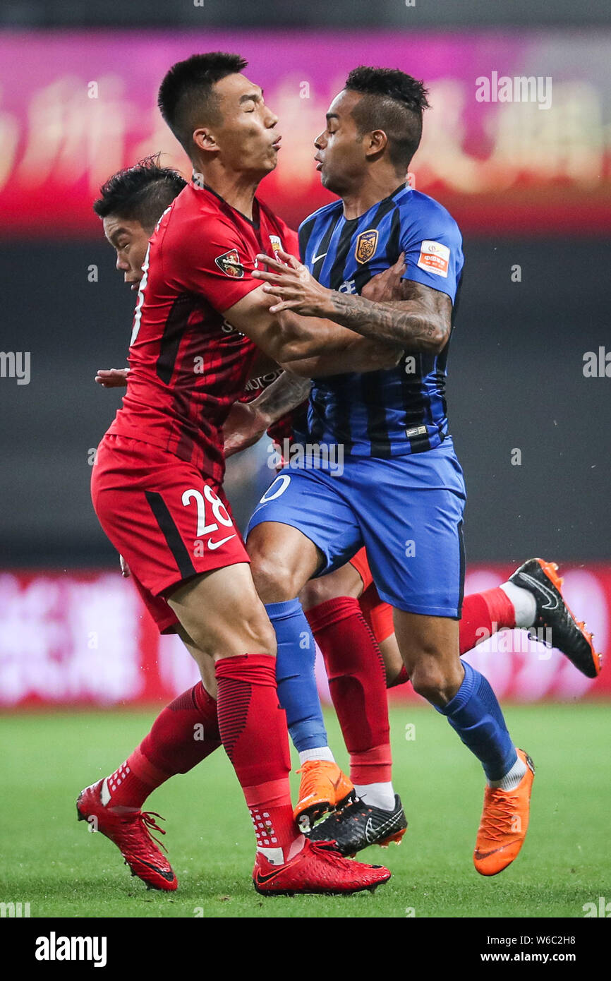 Brazilian football player Alex Teixeira of Jiangsu Suning, right ...