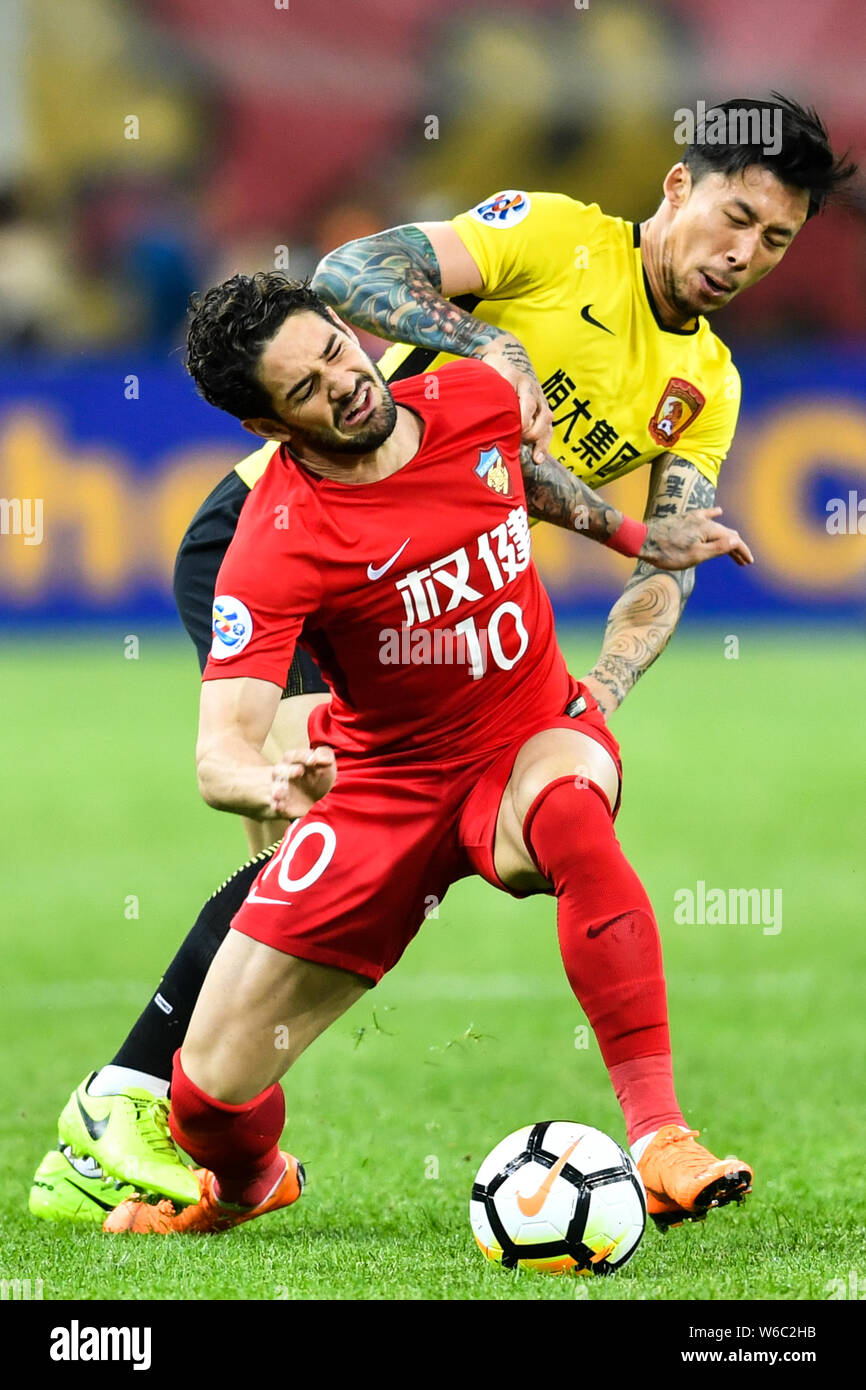 Zhang Linpeng, right, of China's Guangzhou Evergrande Taobao challenges ...