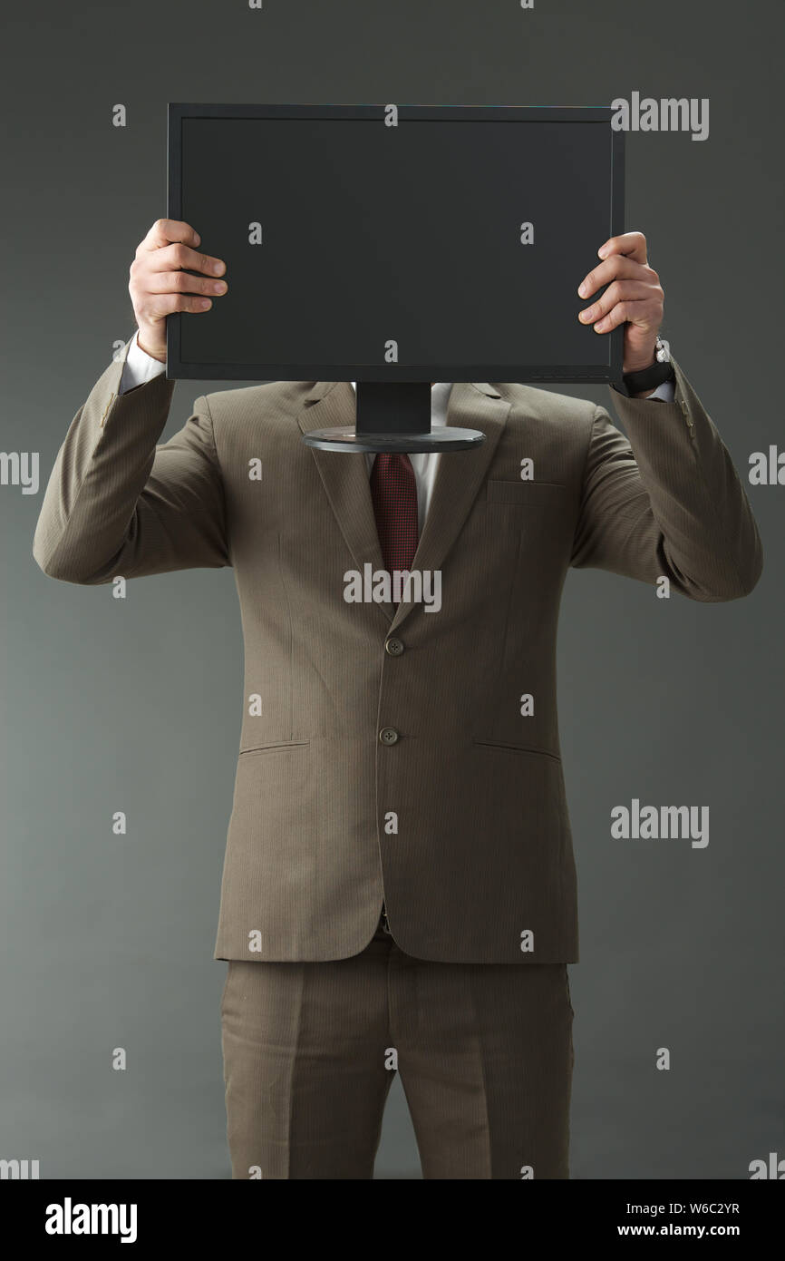 Businessman hiding behind computer monitor hi-res stock photography and ...