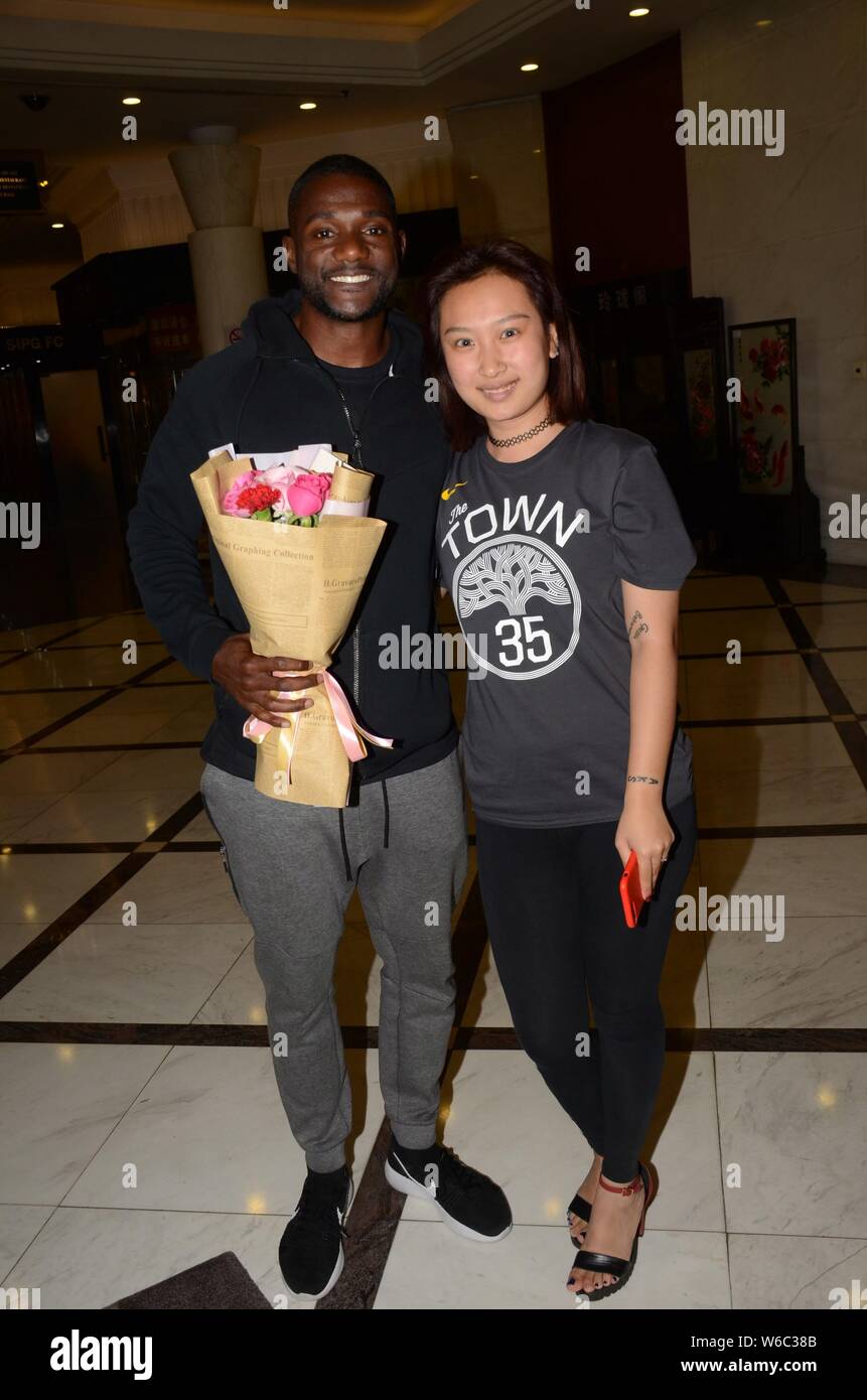 American sprinter Justin Gatlin, left, poses for photos with a fan ...