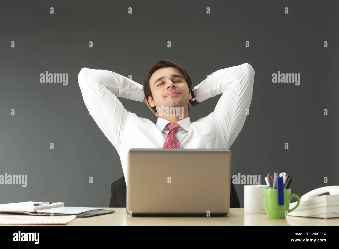 Businessman sleeping in an office Stock Photo - Alamy