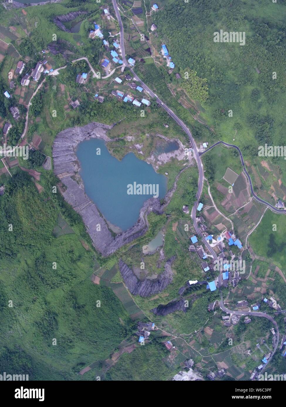 Aerial view of a heart-shape pond which was once a stone quarry ...