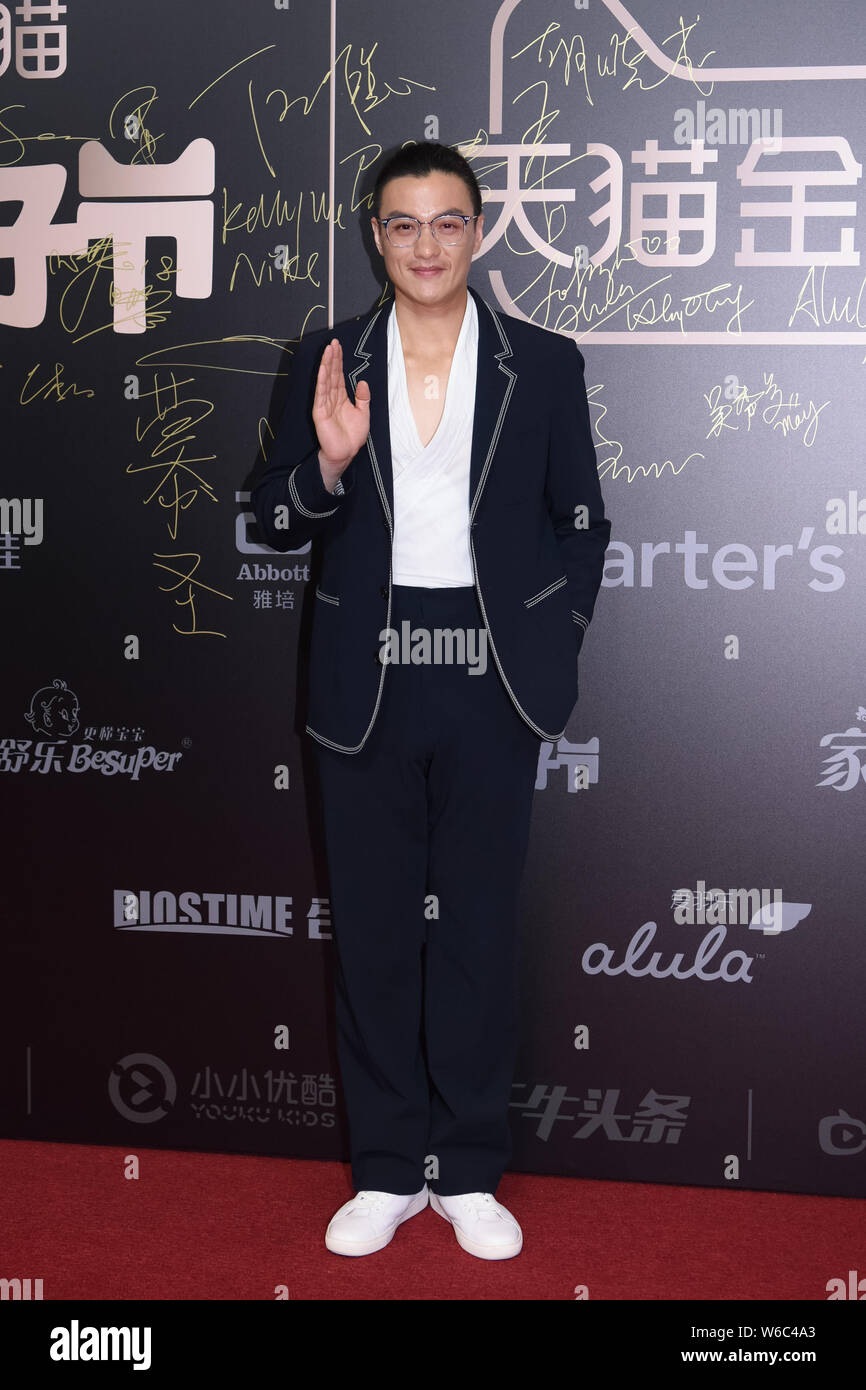 Chinese actor Zhou Yiwei poses as he arrives on the red carpet for ...
