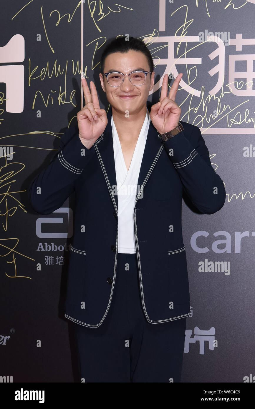 Chinese actor Zhou Yiwei poses as he arrives on the red carpet for ...