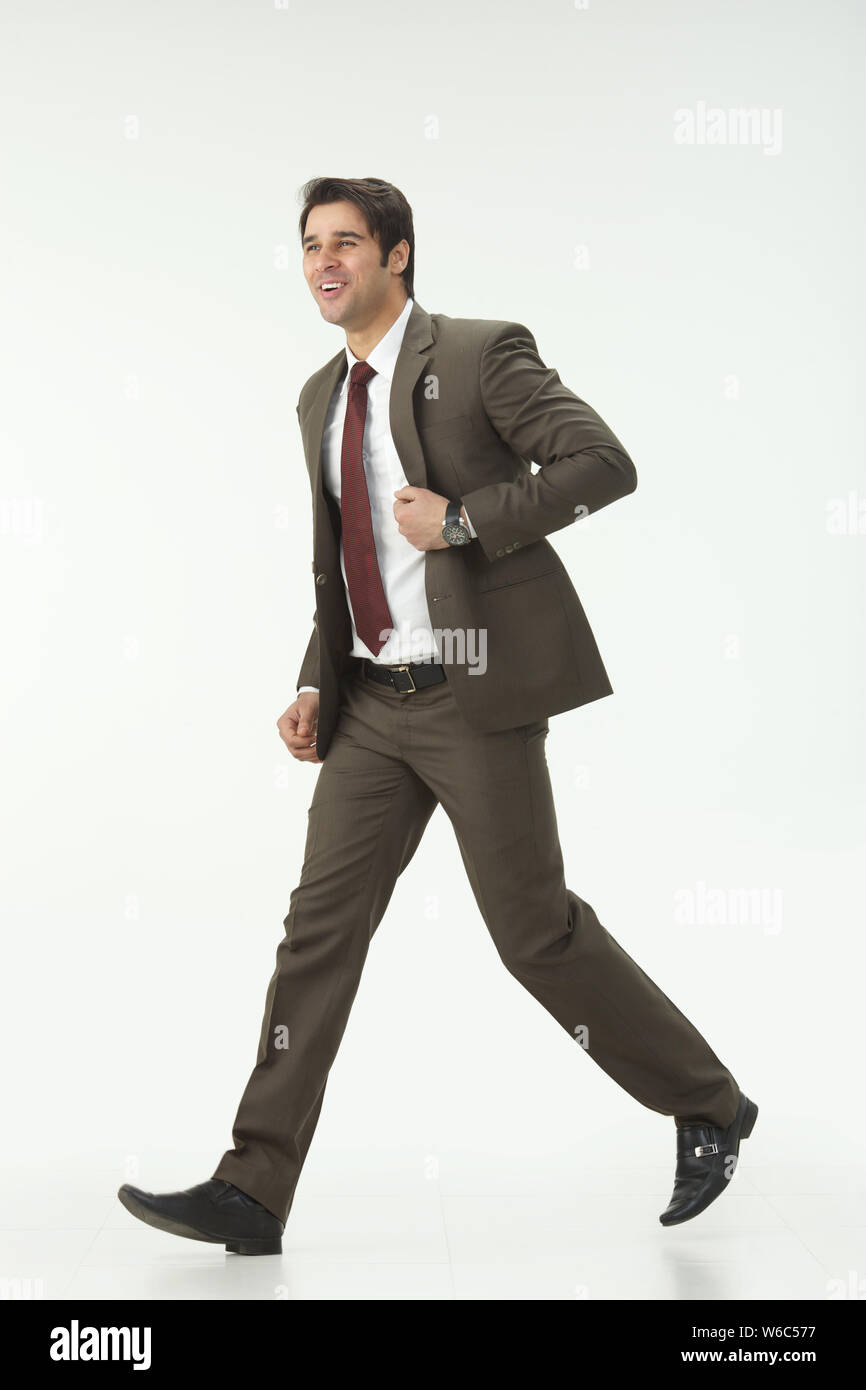 Young happy man running suit hi-res stock photography and images - Alamy