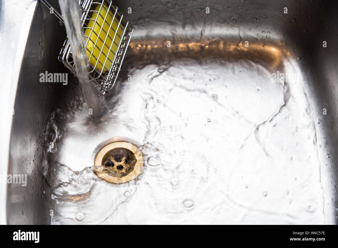Soap shaker in use in the kitchen. Used to create soapy water to wash ...