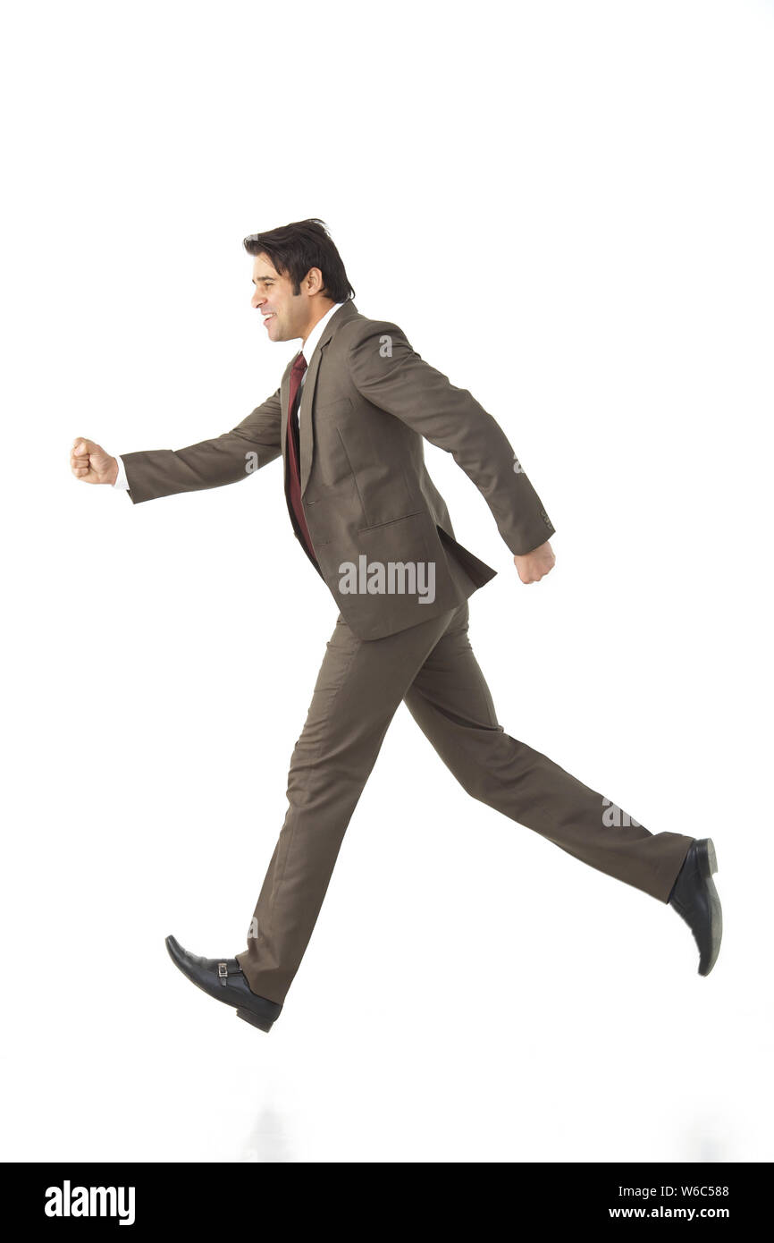 Young happy man running suit hi-res stock photography and images - Alamy