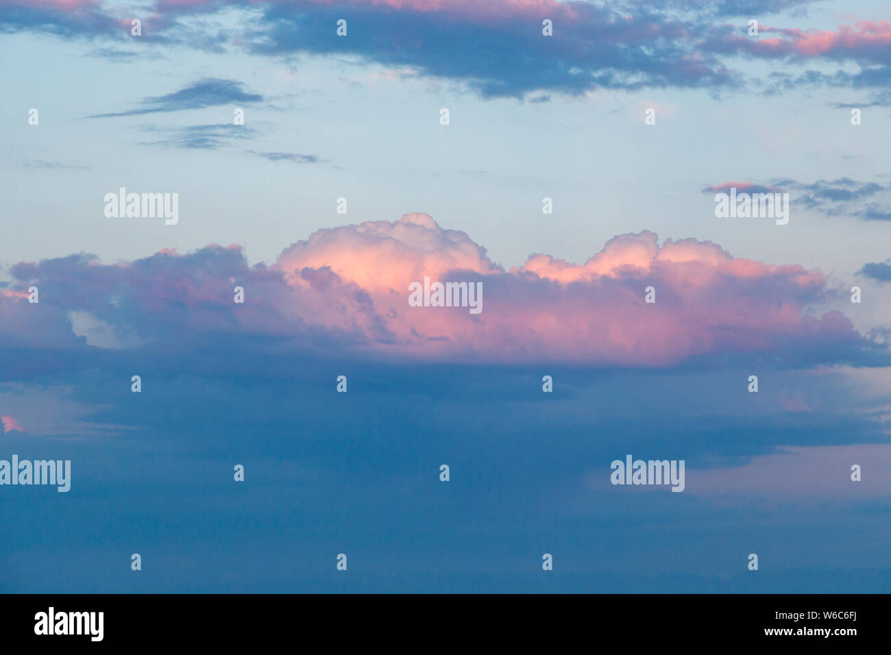 blue sky with clouds backlit by the soft rays of the sun Stock Photo ...