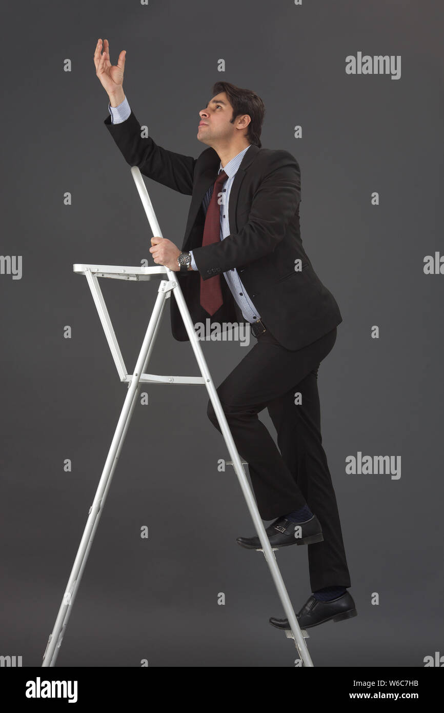 Holding step ladder hi-res stock photography and images - Alamy