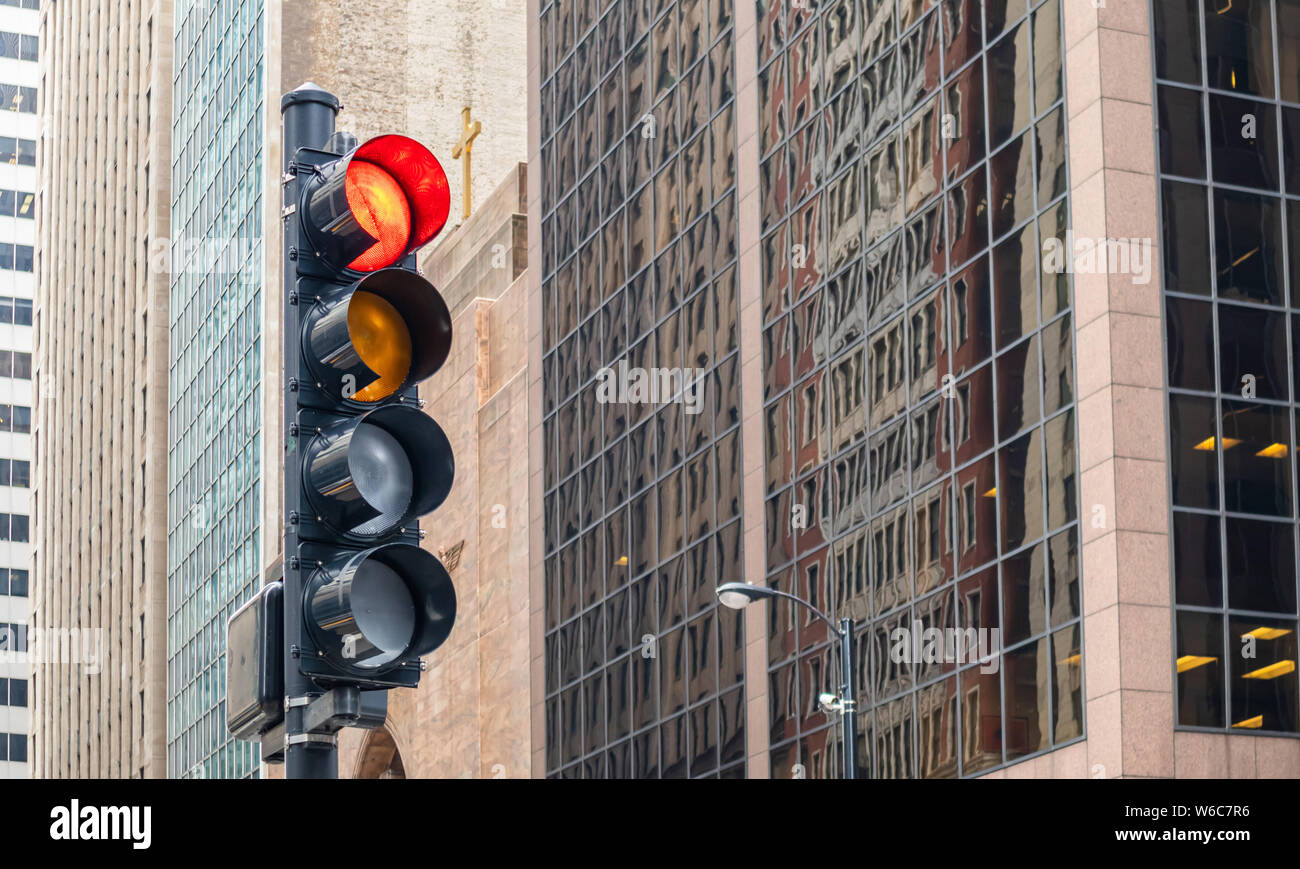 Stop sign. Red traffic lights for cars, office high rise buildings ...