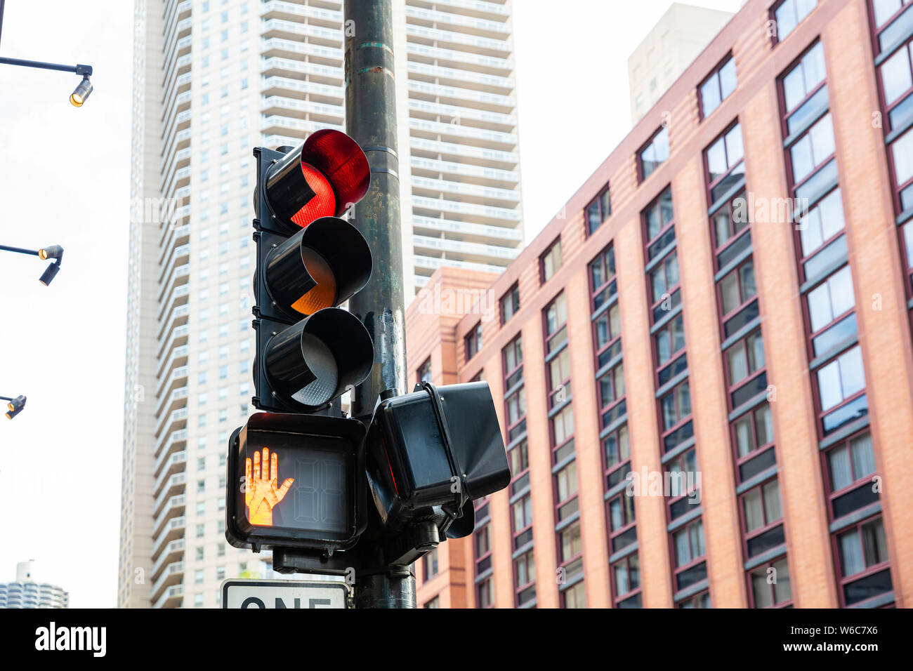 Stop sign. Red traffic lights for cars, office high rise buildings ...