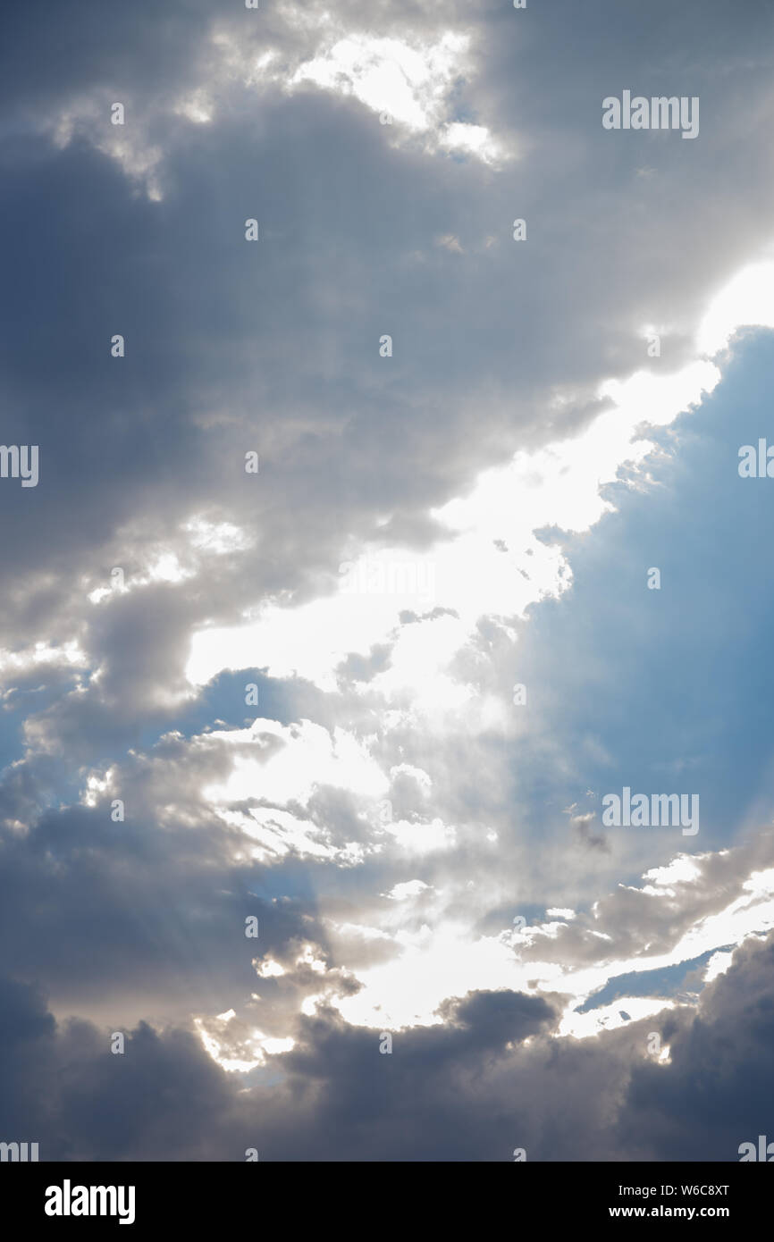 blue sky with clouds backlit by the soft rays of the sun Stock Photo ...