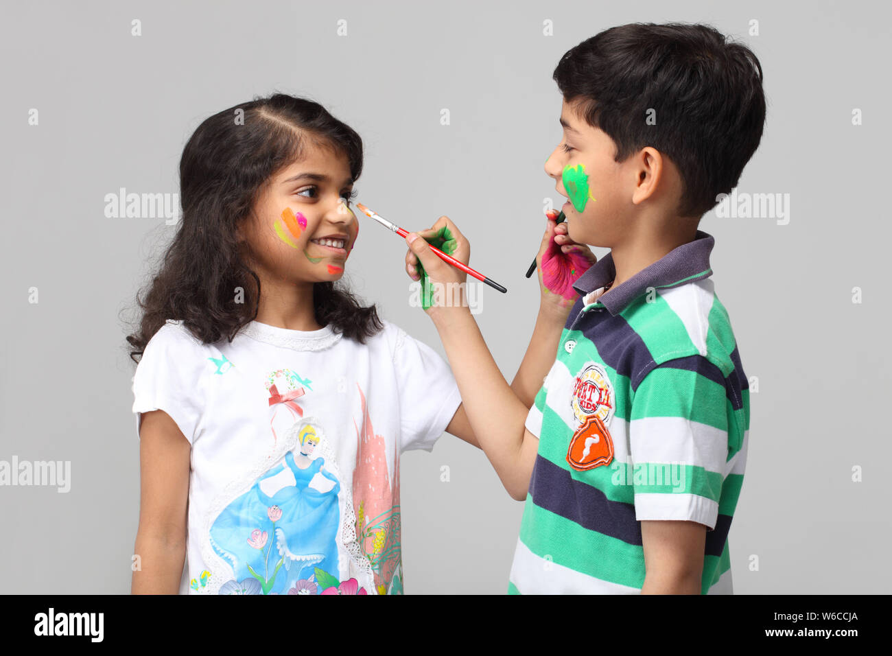 Children painting each others face Stock Photo - Alamy