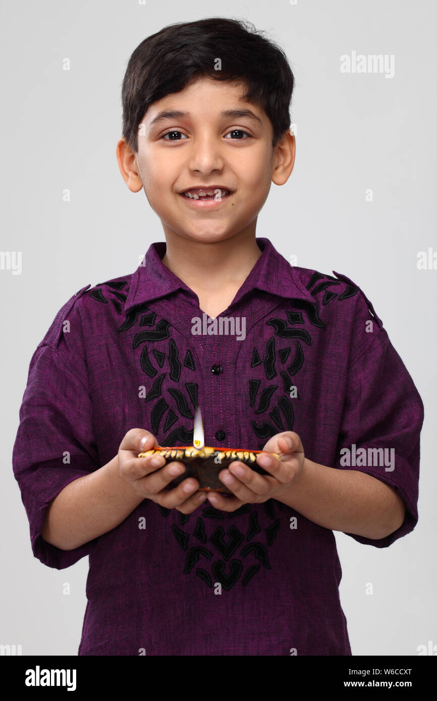 Diya and hand hi-res stock photography and images - Alamy