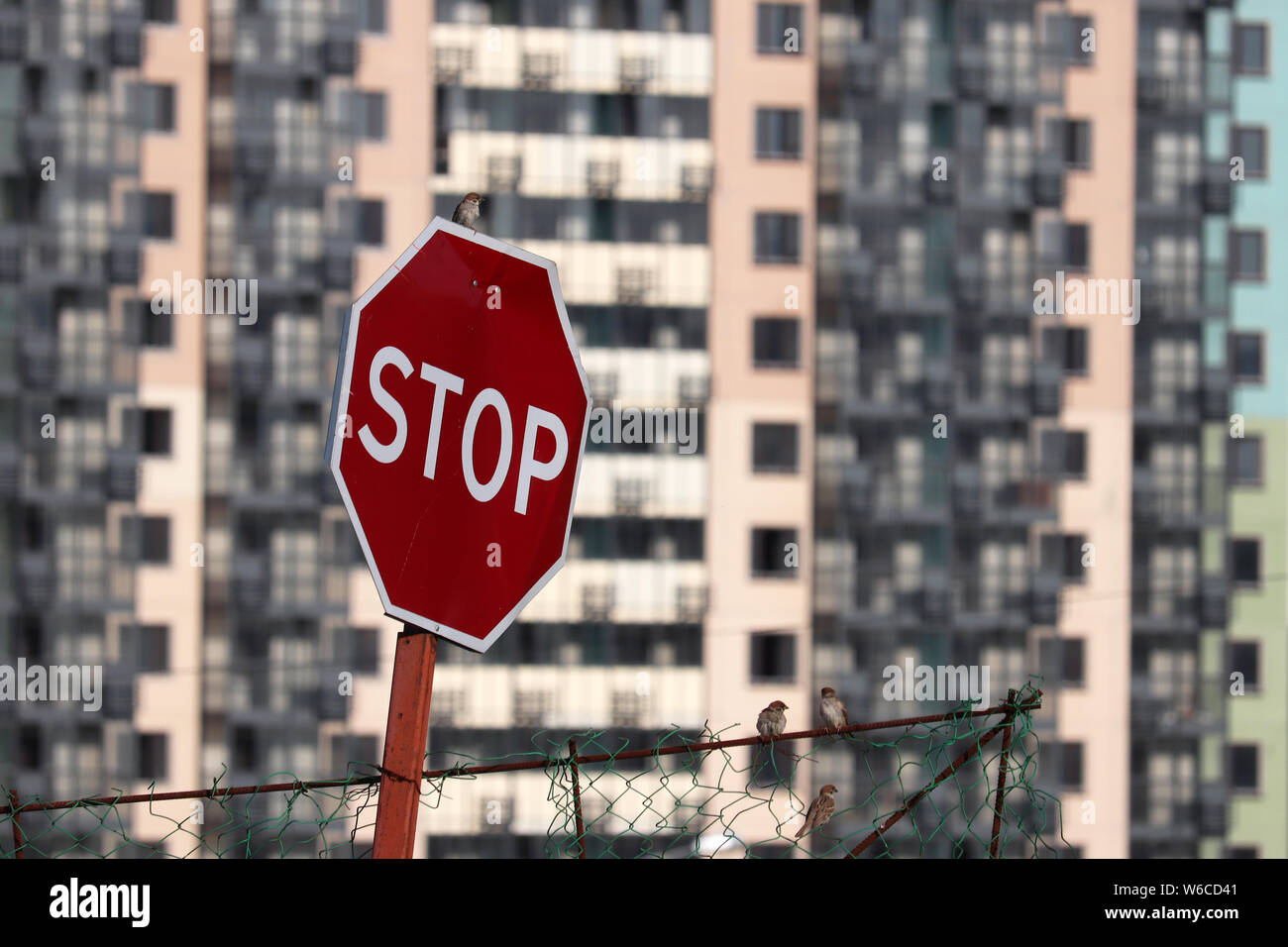 Stop sign on the residential building background, entry is prohibited ...