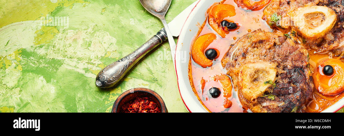 Meat stew with apricot.Ossobuco,dish of Italian cuisine.Stewed calf leg ...