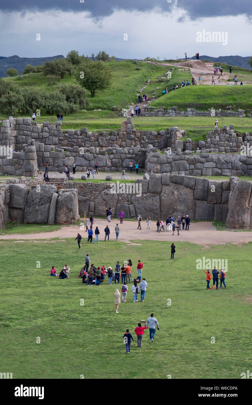 Tourists at the citadel of Sacsahuayman, a native Inca complex ...
