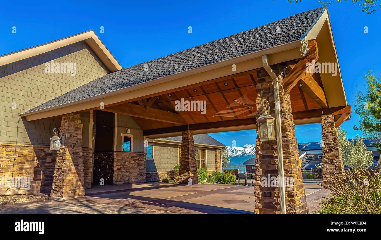 Panorama Pavilion and driveway by the entrance of a house under blue ...
