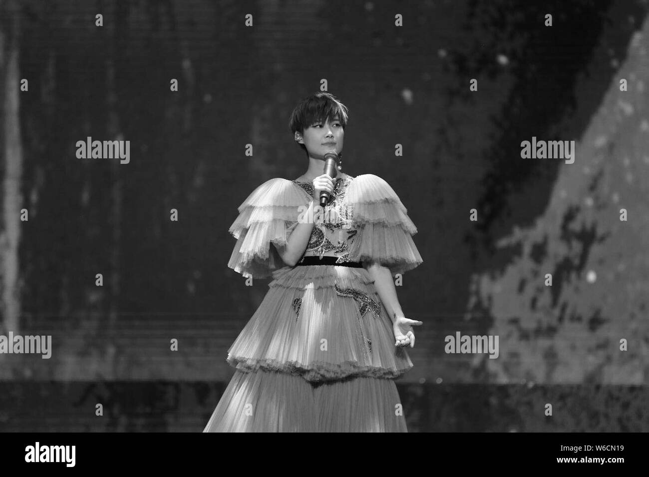 Chinese singer Li Yunchun performs during her concert in Shanghai ...